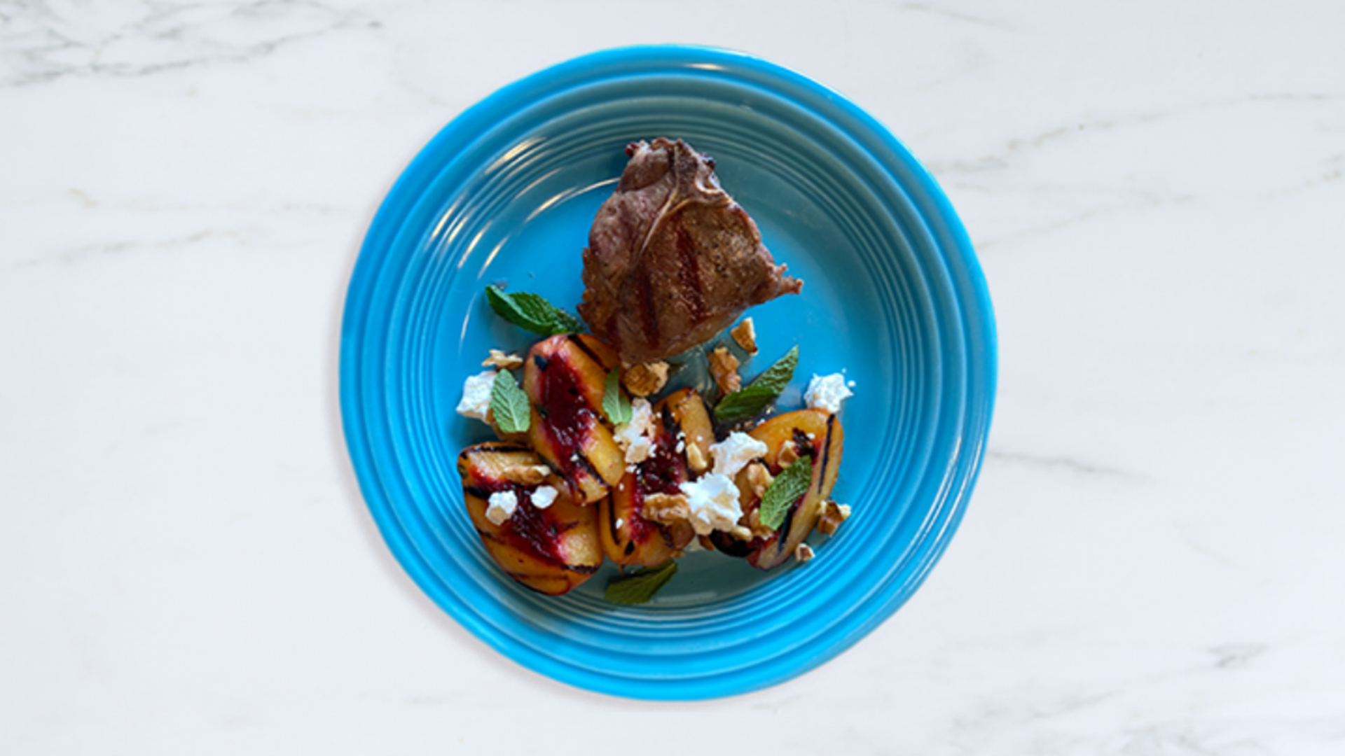Colorado Grilled Lamb Chops With Grilled Peaches, Mint, & Cheese